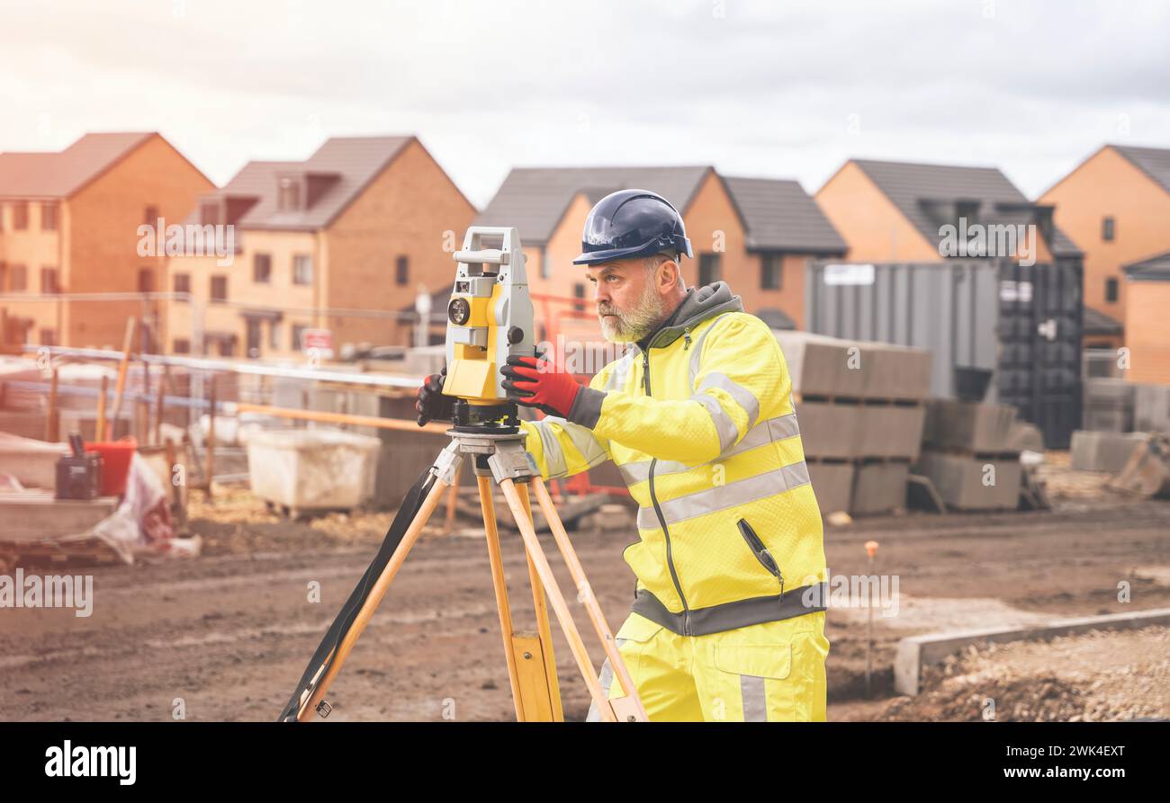 Surveyor builder site engineer with theodolite total station at ...