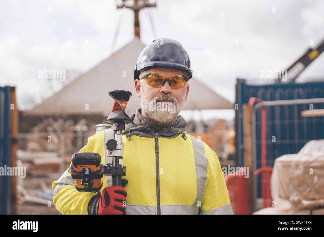 Closeup portrait of a Surveyor builder site engineer with theodolite ...