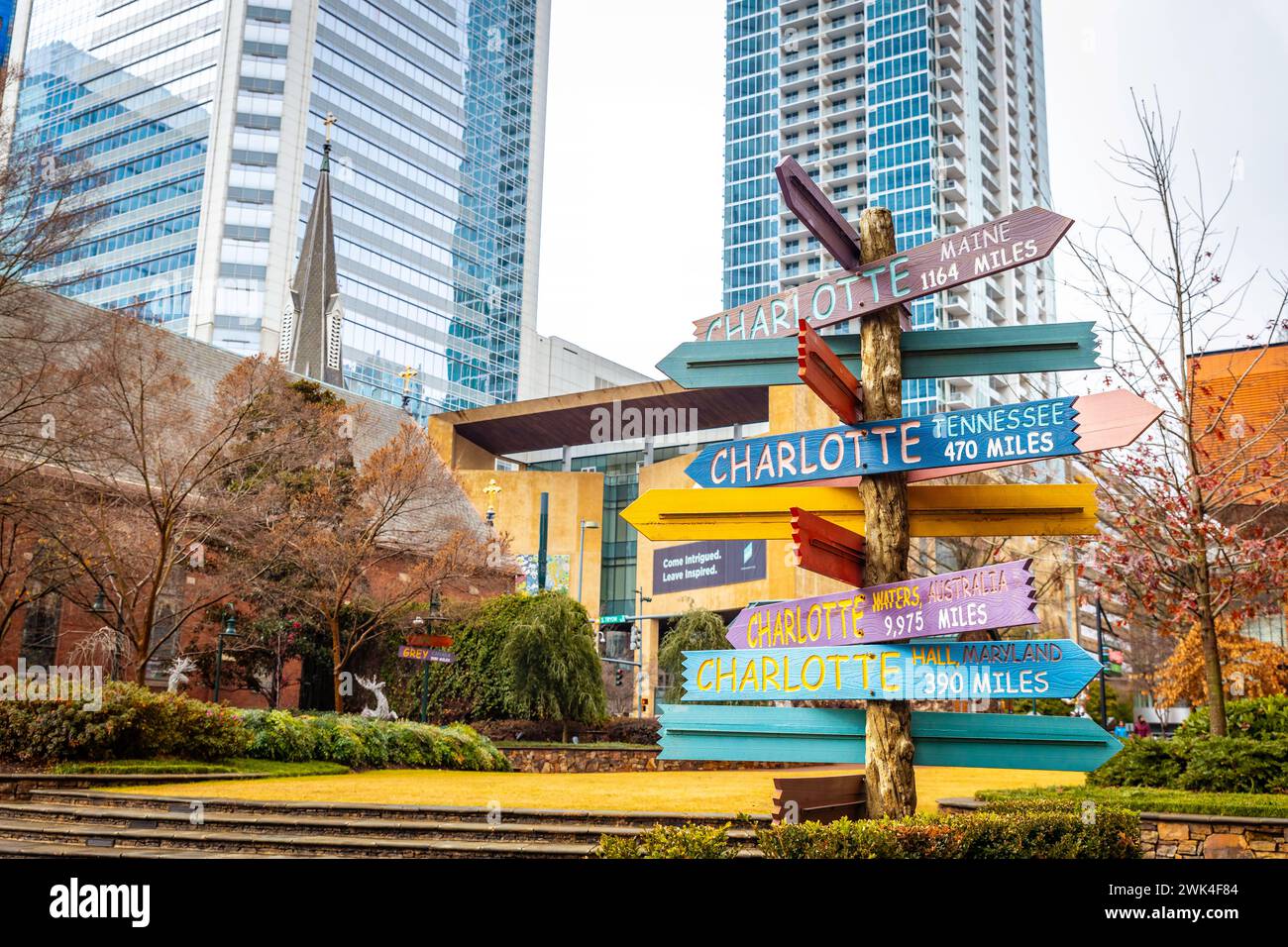 Colorful directions signs in Charlotte The Green city center park at ...