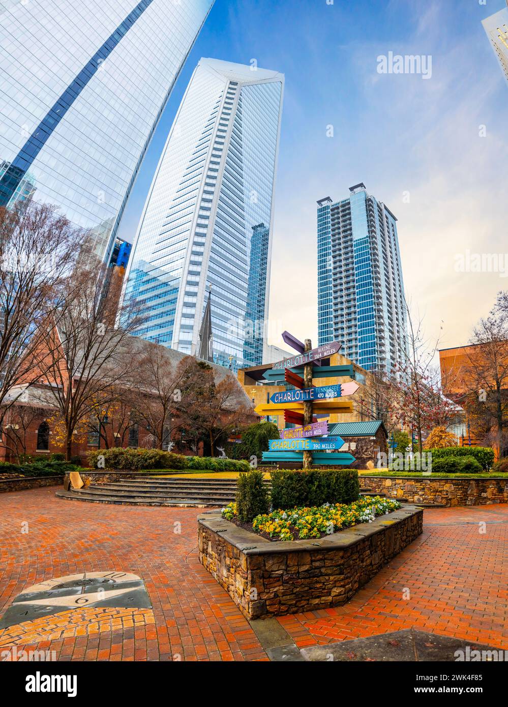 Colorful directions signs in Charlotte The Green city center park at ...
