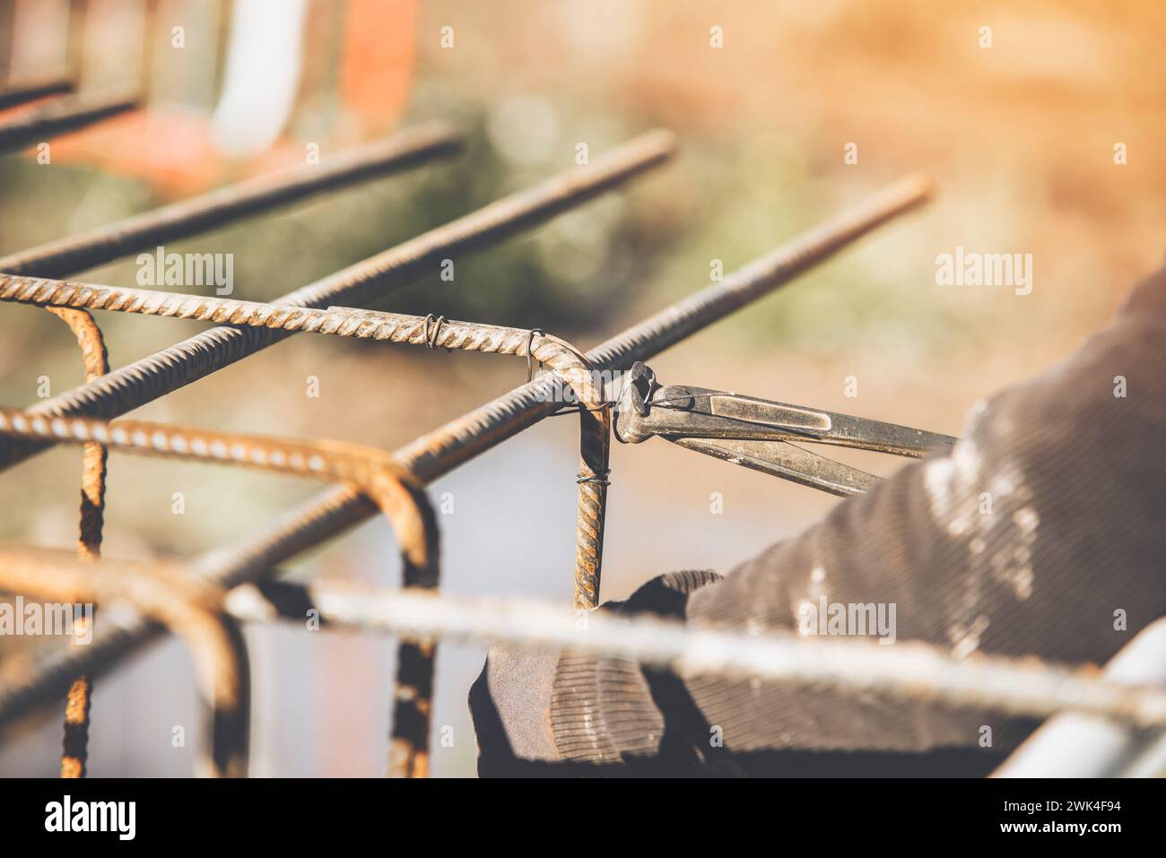 Construction worker steel fixer working at the building site close-up ...