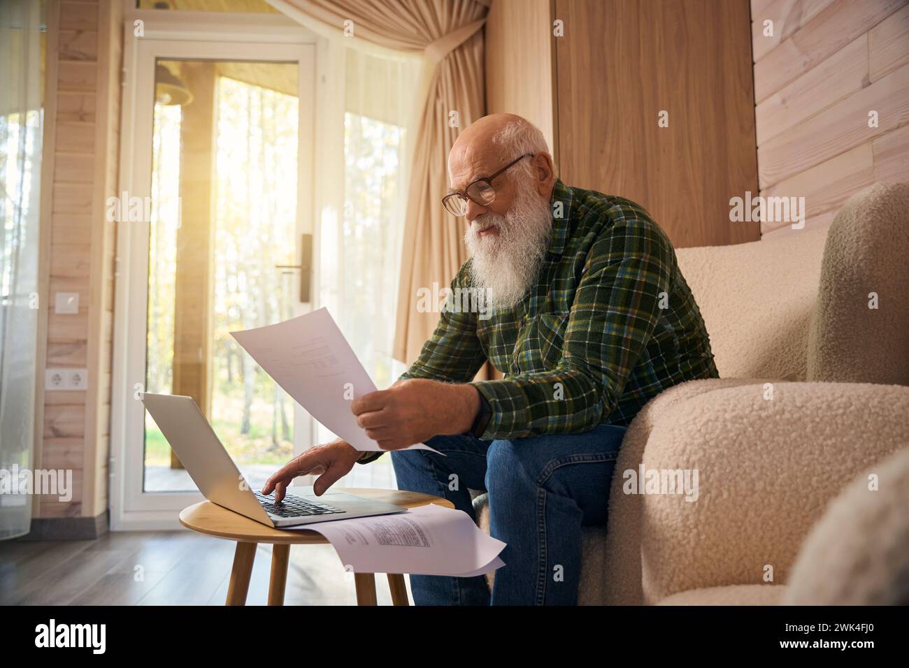 Elderly pensioner works documents hi-res stock photography and images ...
