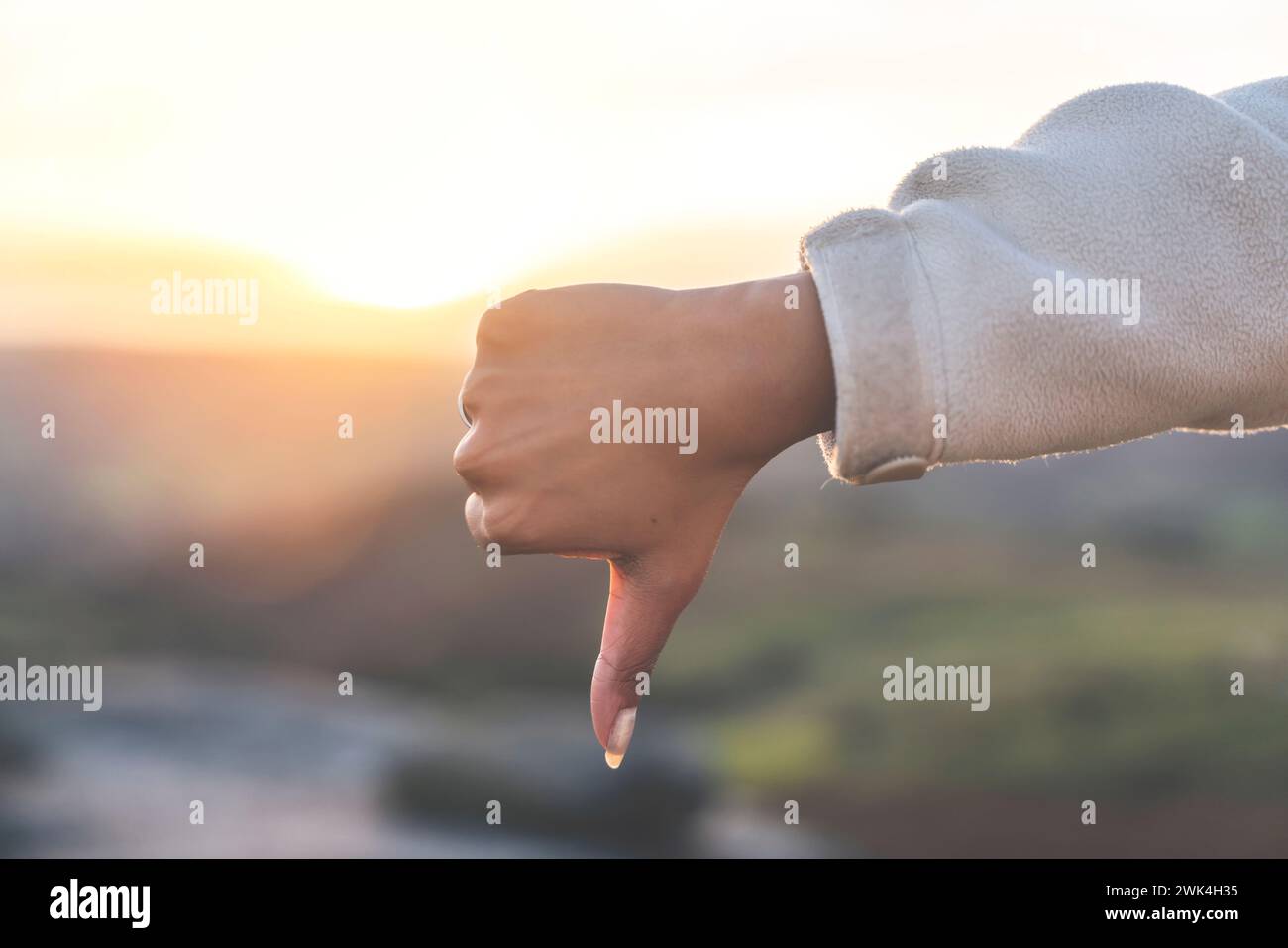 woman giving thumb down gesture, dislikes something, having disgusting ...