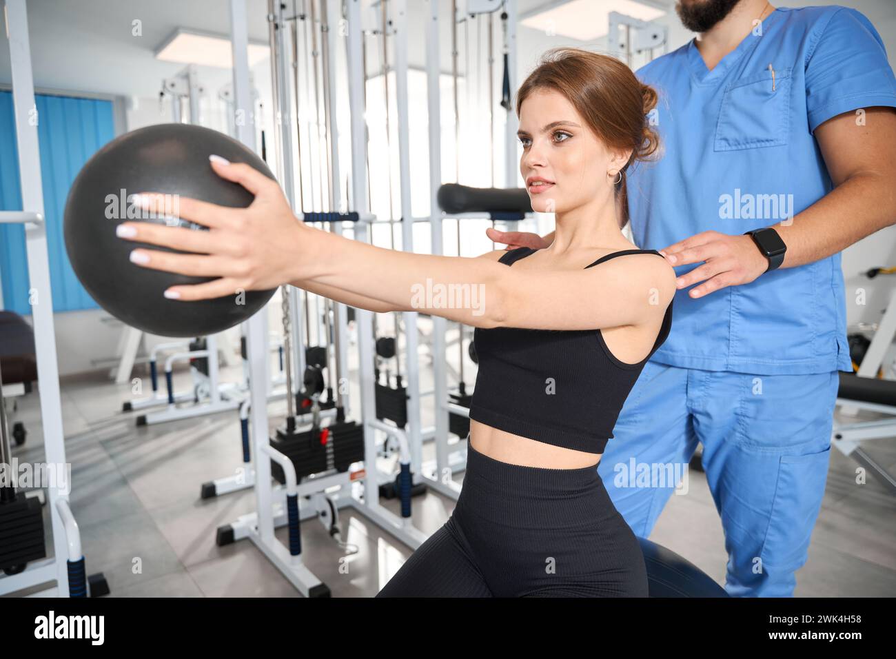 Female doing exercises under trainer hi-res stock photography and ...