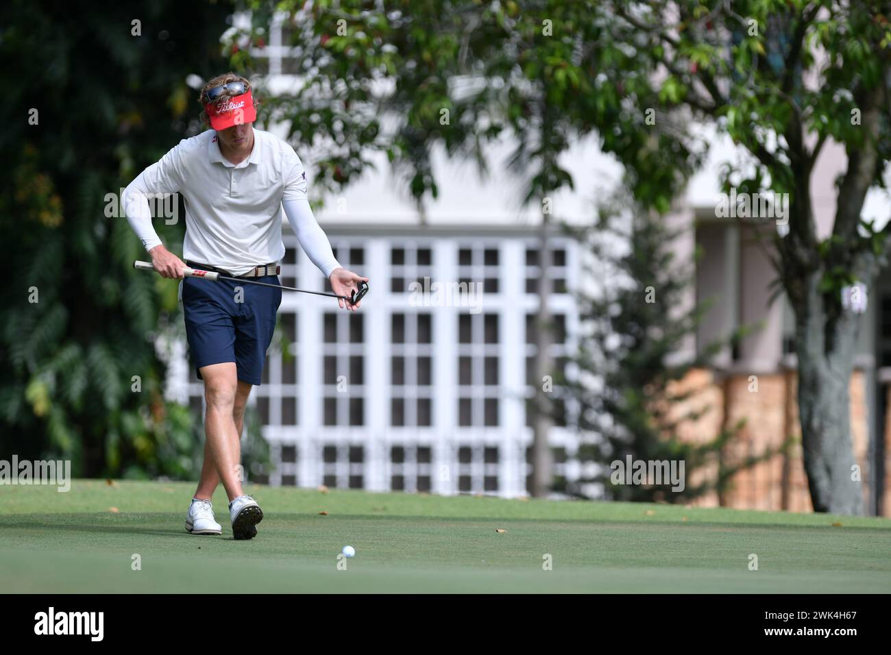 SERDANG - FEB 18: Jared Du Toit of Canada line up at the 3rd hole ...