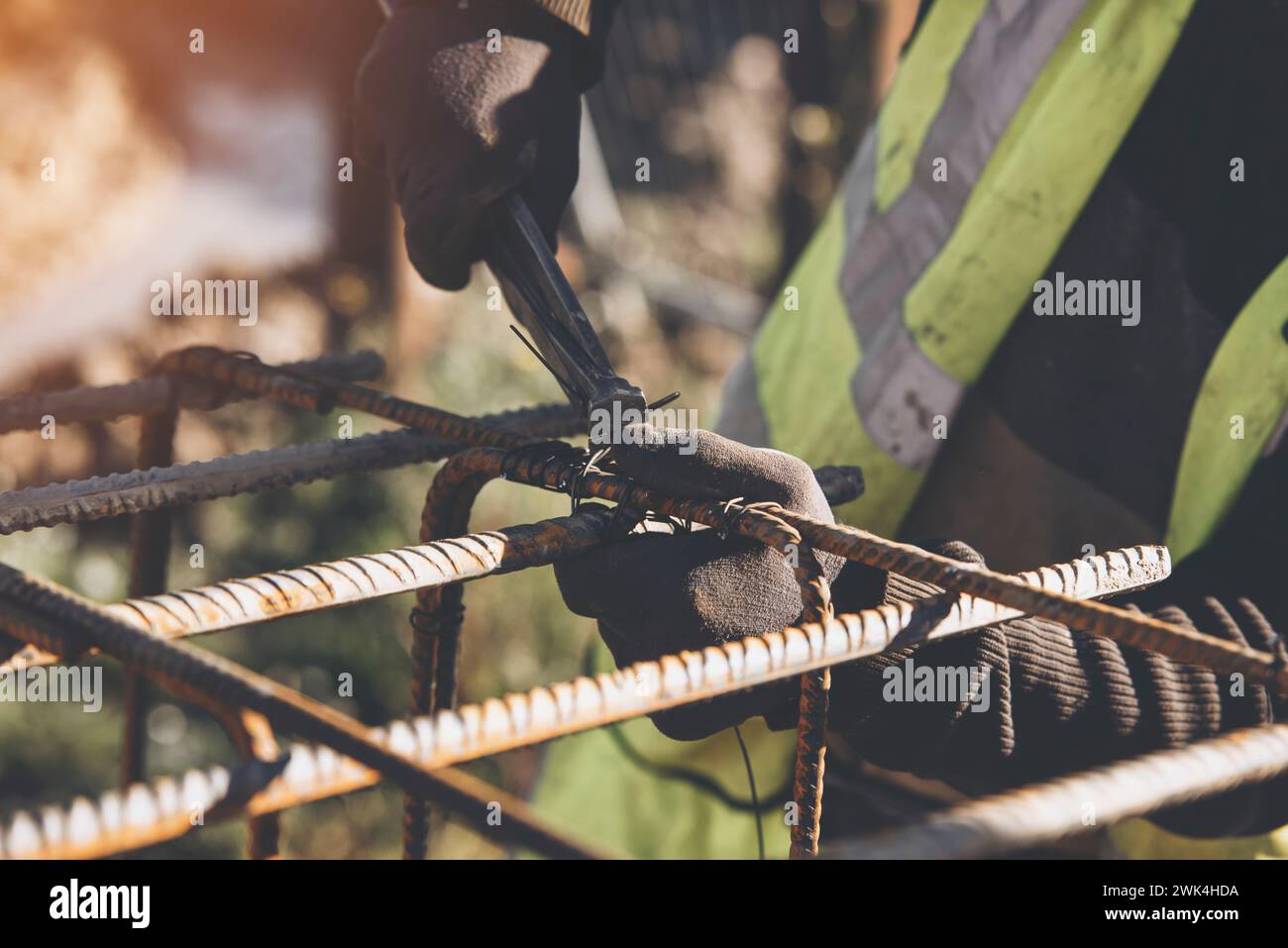 Construction worker steel fixer working at the building site close-up ...