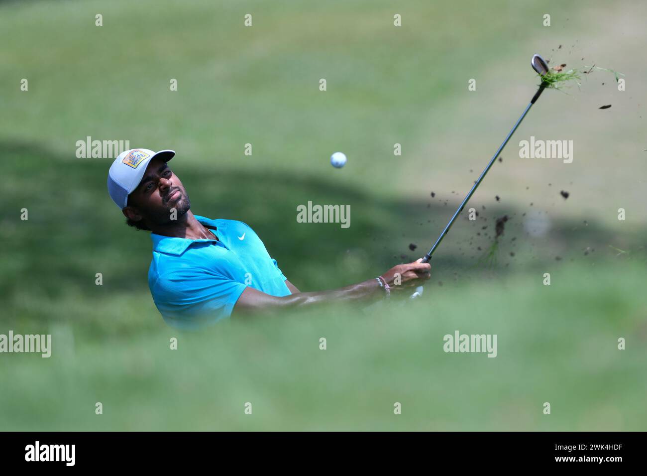 SERDANG - FEB 18: Khavis Varadan of Malaysia chips in at the 17th green ...