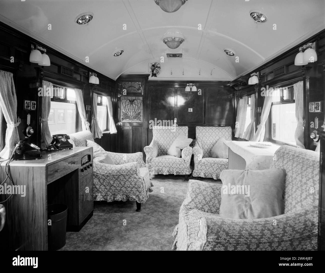 Vintage Private train car lounge, with upholstered chairs, carpet and ...