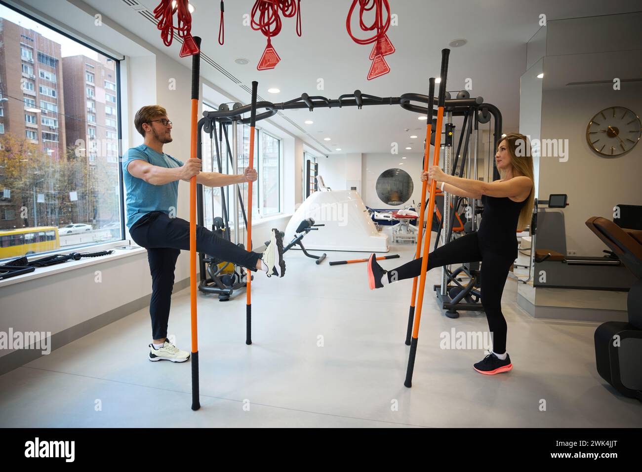 Female and male perform balance exercises Stock Photo - Alamy