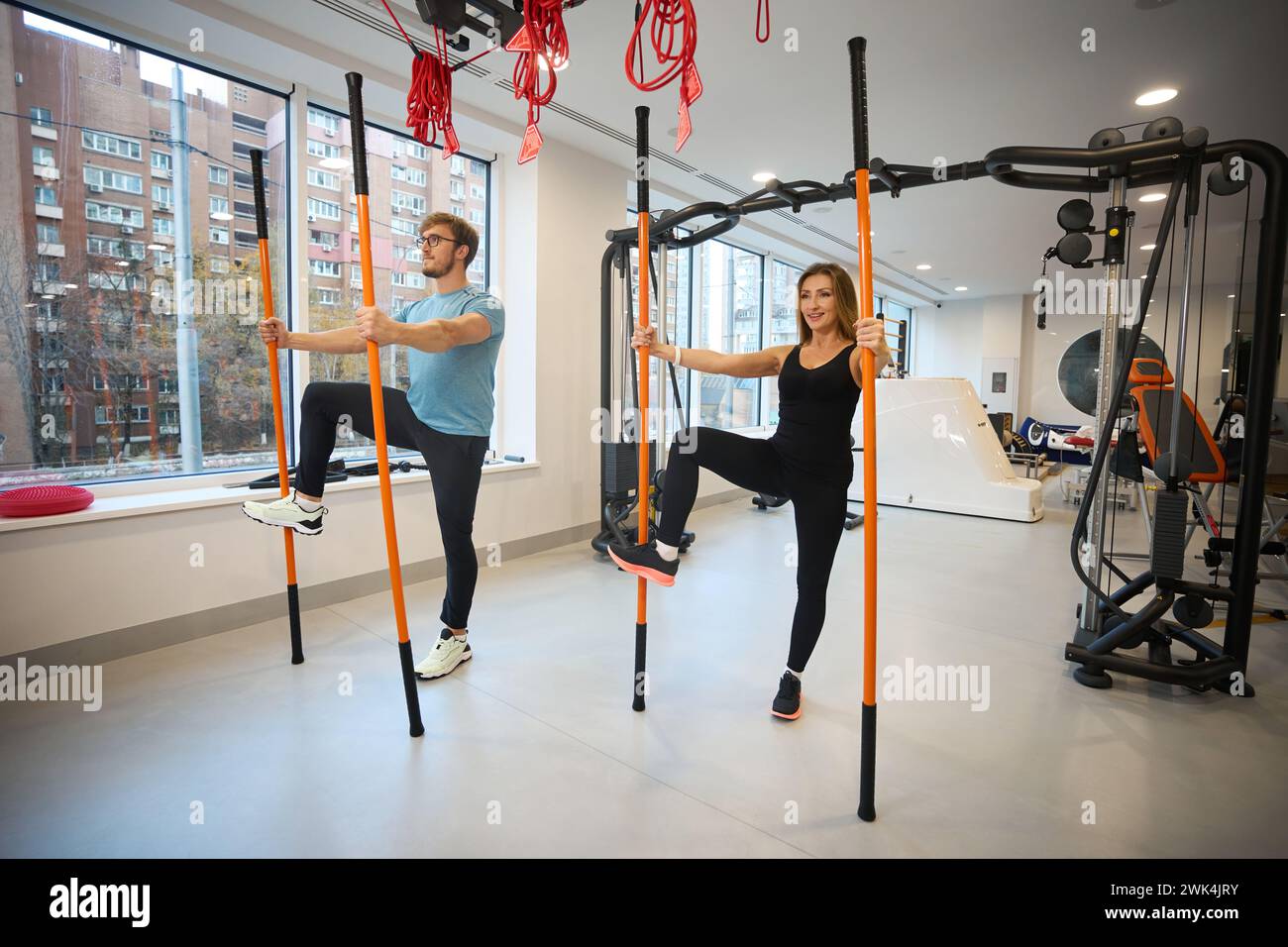 Wellness center clients perform balance exercises Stock Photo - Alamy