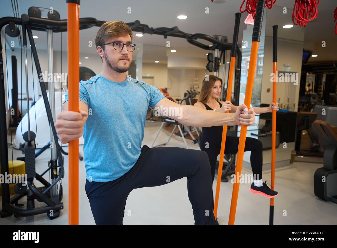 People in the gym perform balance exercises Stock Photo - Alamy