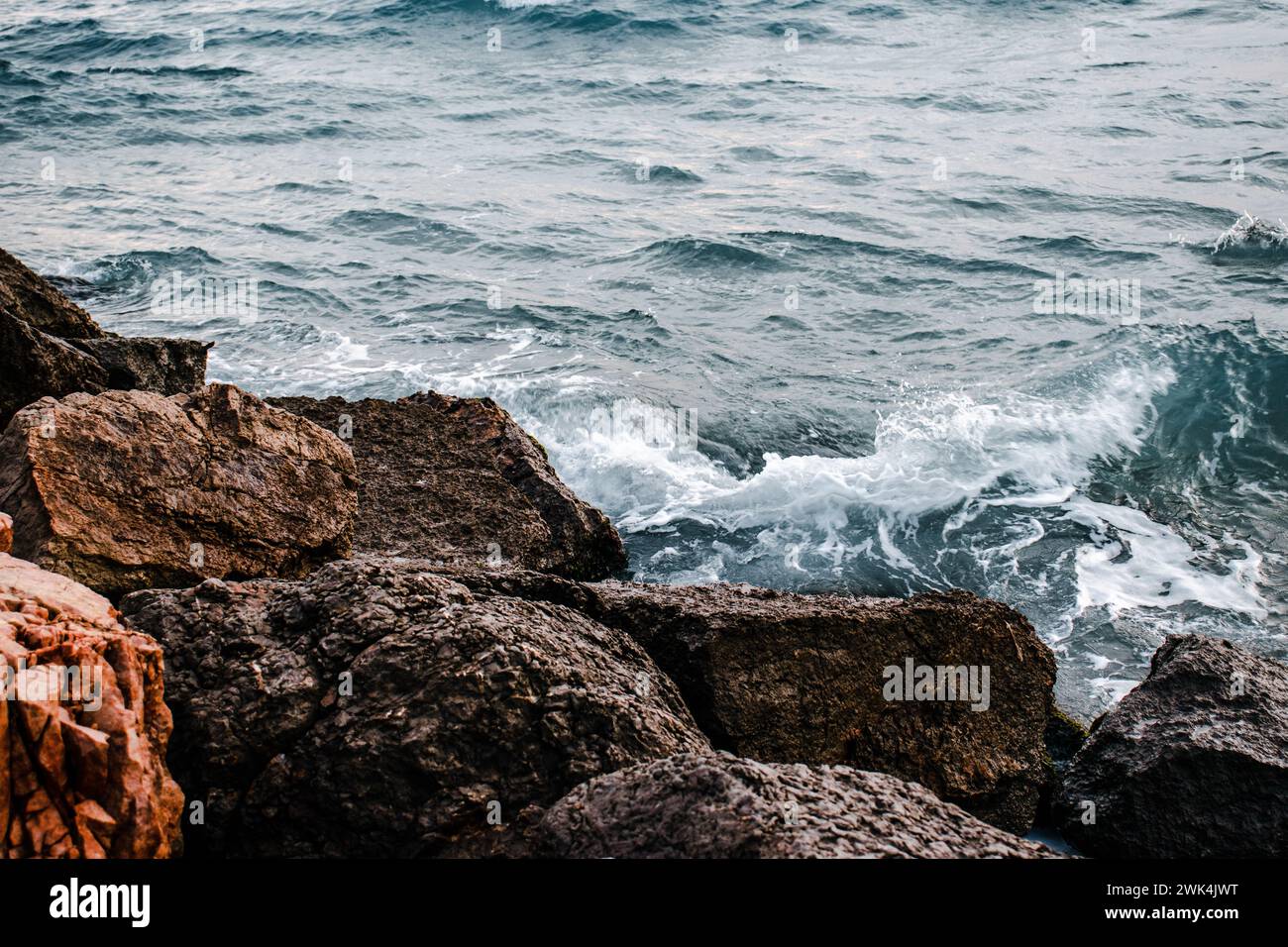 Winter sea with stones on the beach concept photo. Underwater rock ...