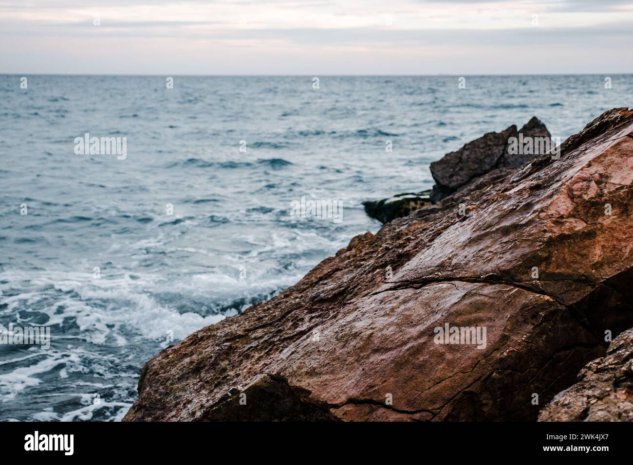 Winter sea with stones on the beach concept photo. Underwater rock ...