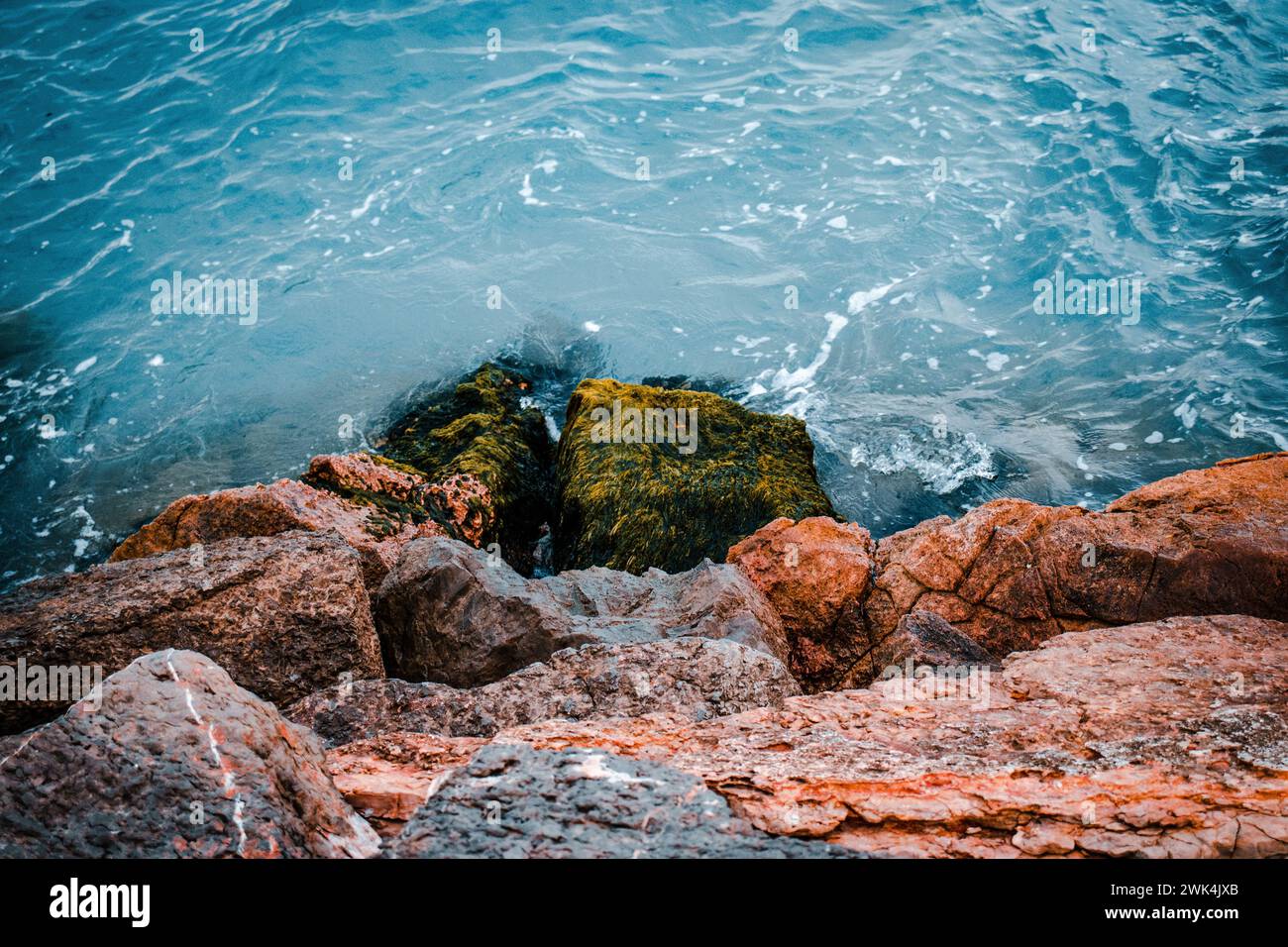 Close up water with stones on the beach concept photo. Underwater rock ...