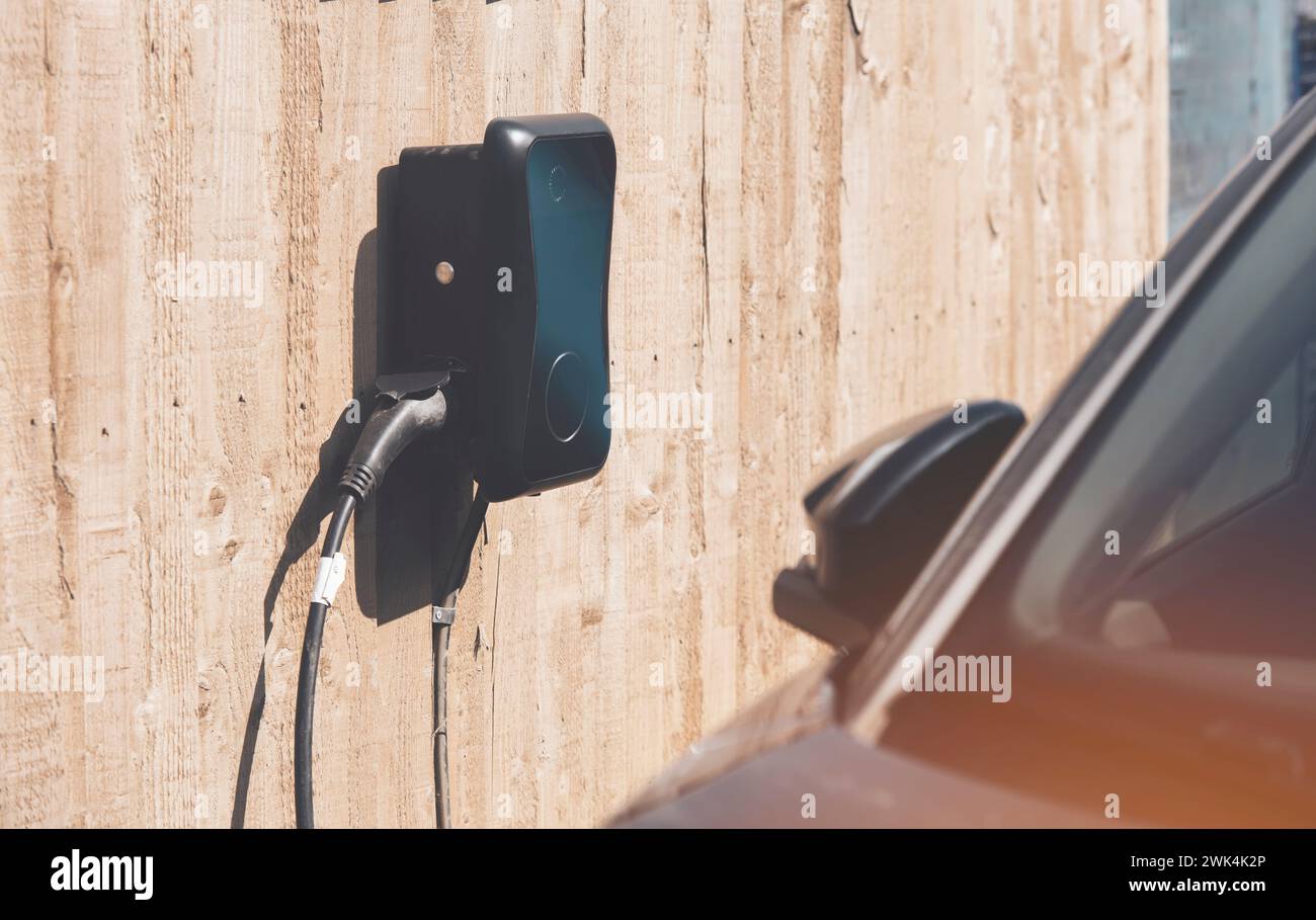 Electric vehicle domestic charging point installed outside of the house ...