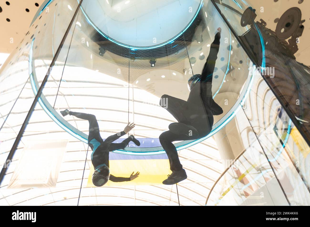 Skydivers in indoor wind tunnel, free fall simulator Stock Photo - Alamy