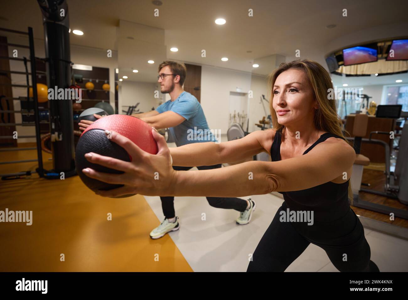 People perform exercises with a ball Stock Photo - Alamy