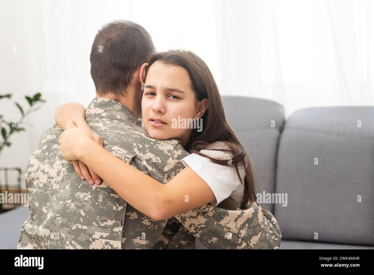 pretty little girl hugging her military father Stock Photo - Alamy