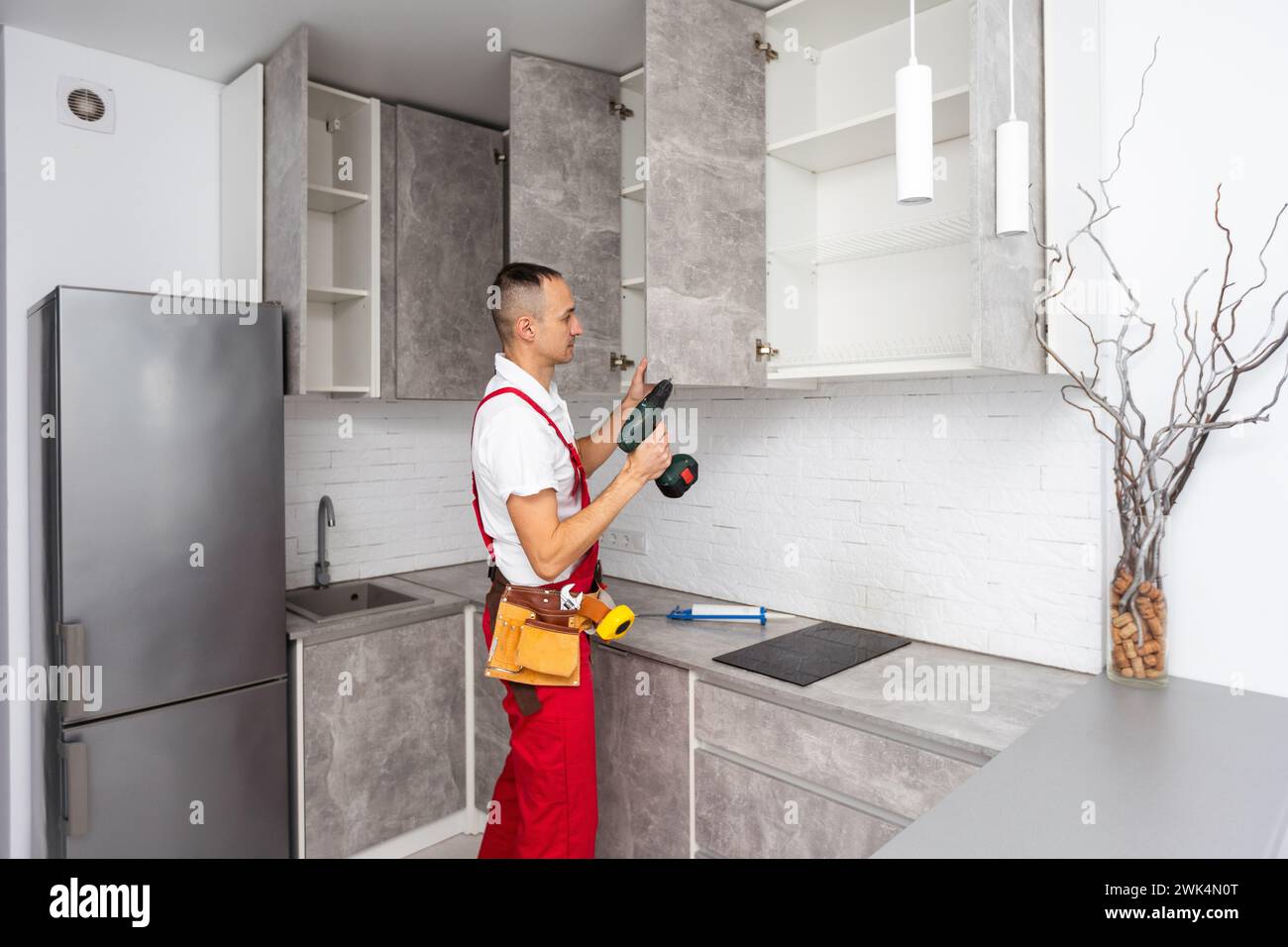 Male worker drilling ceiling hi-res stock photography and images - Alamy