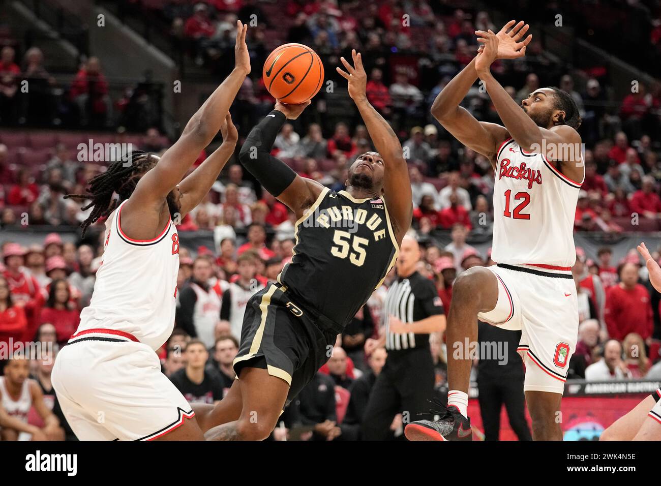 Purdue guard Lance Jones (55) shoots between Ohio State guard Bruce ...