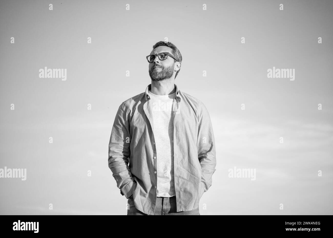 pensive caucasian man look peaceful. pensive man in glasses outdoor ...