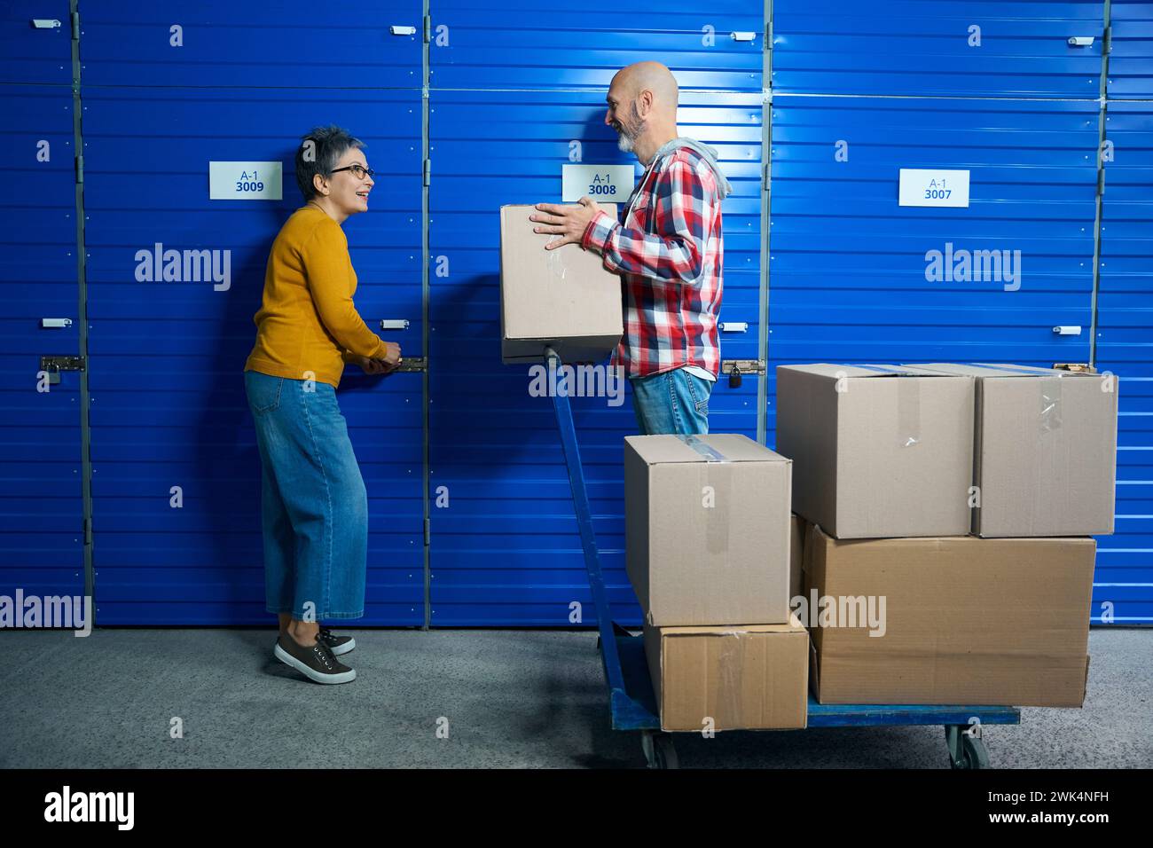 People open the entrance to the storage room Stock Photo - Alamy