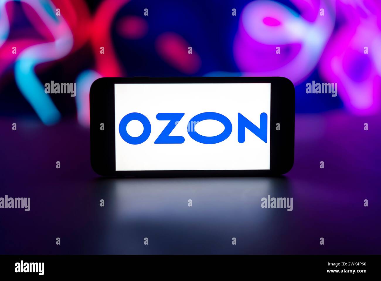 In this photo illustration, the ozon logo is seen displayed on a mobile ...