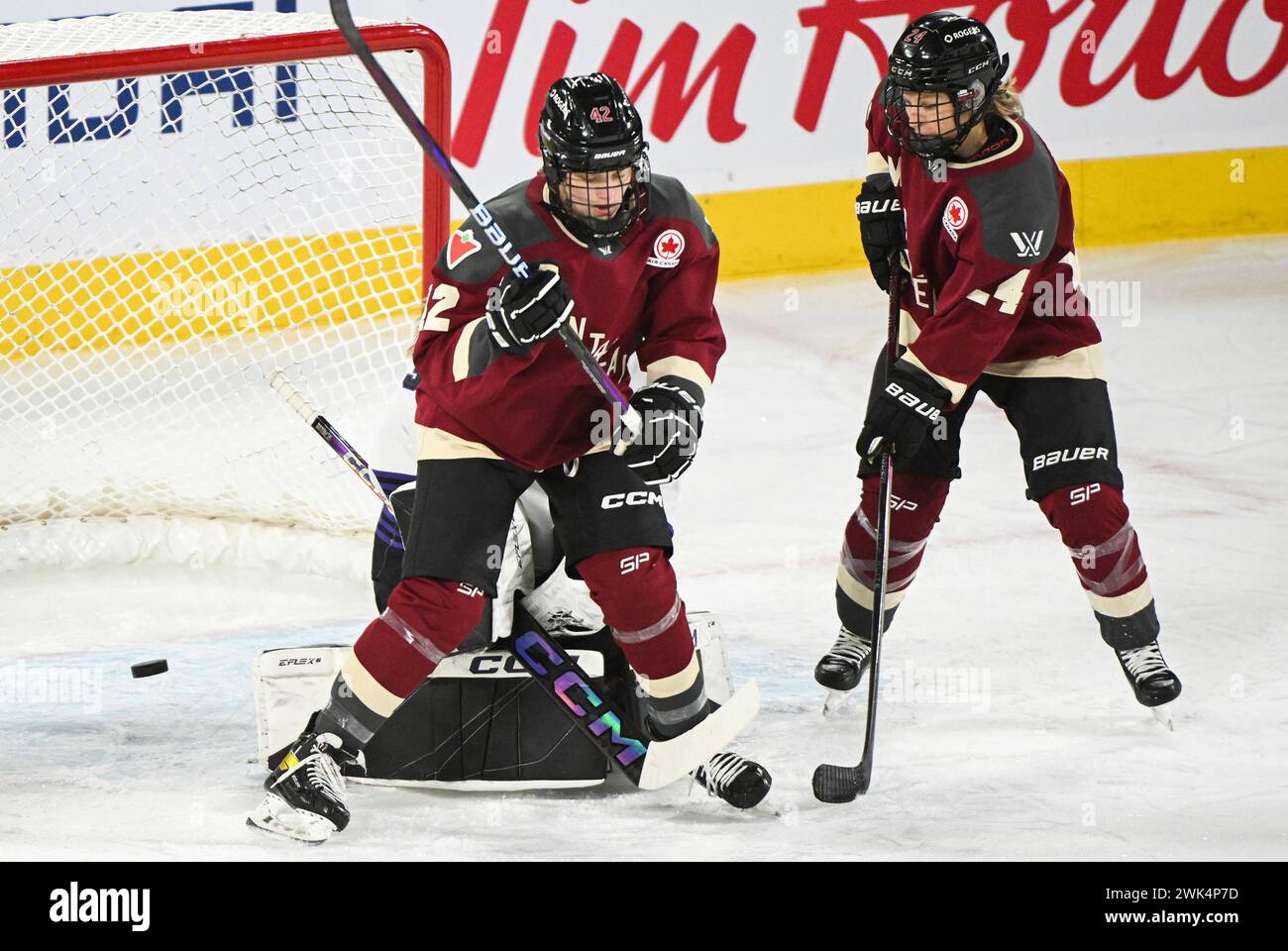 Montreal's Claire Dalton tips the puck past Minnesota goaltender Maddie ...