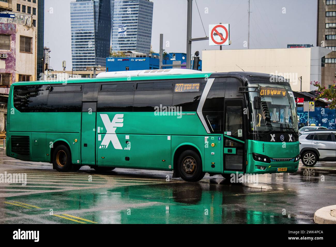 Tel Aviv, Israel, February 18, 2024 Local israeli bus under the rain ...