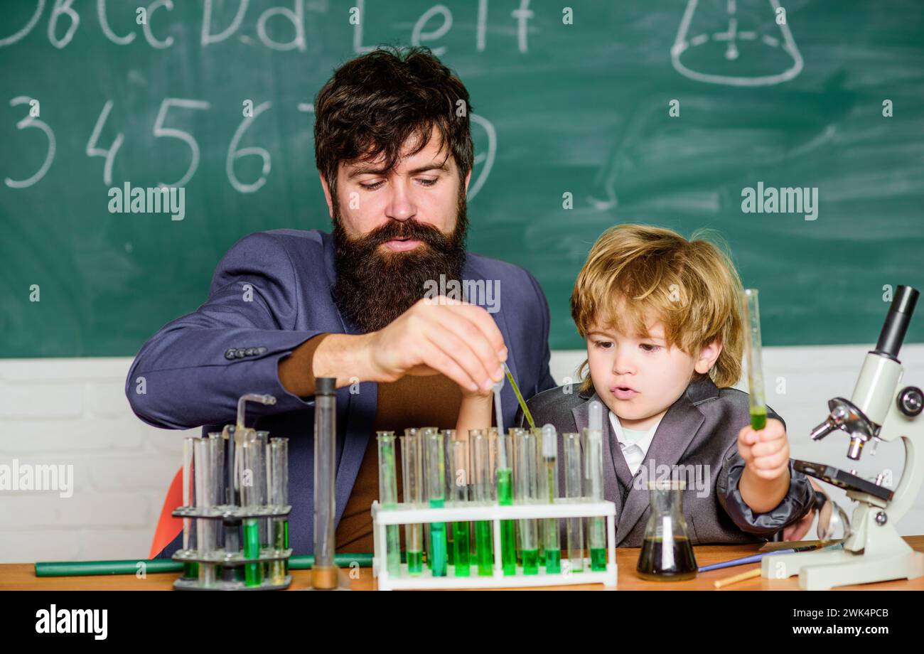 Laboratory test tubes and flasks with colored liquids bearded man ...
