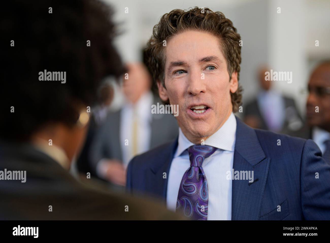 Pastor Joel Osteen talks with reporters after a service Sunday, Feb. 18 ...