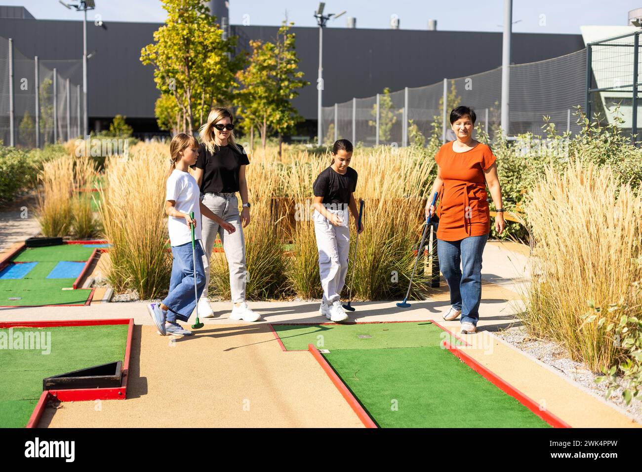 Golf course group of friends people with children posing standing Stock ...