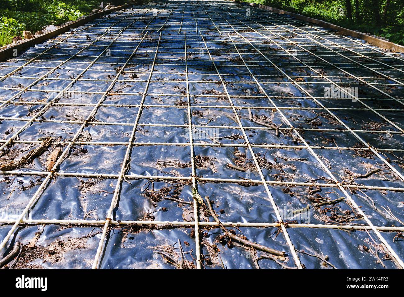 Construction of bicycle paths. Creating a sidewalk in the forest ...