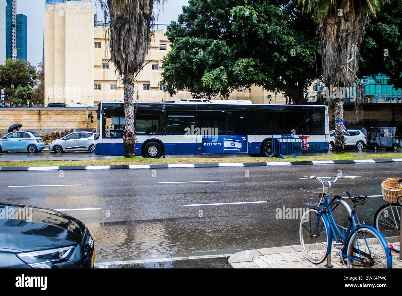 Tel Aviv, Israel, February 18, 2024 Local israeli bus under the rain ...