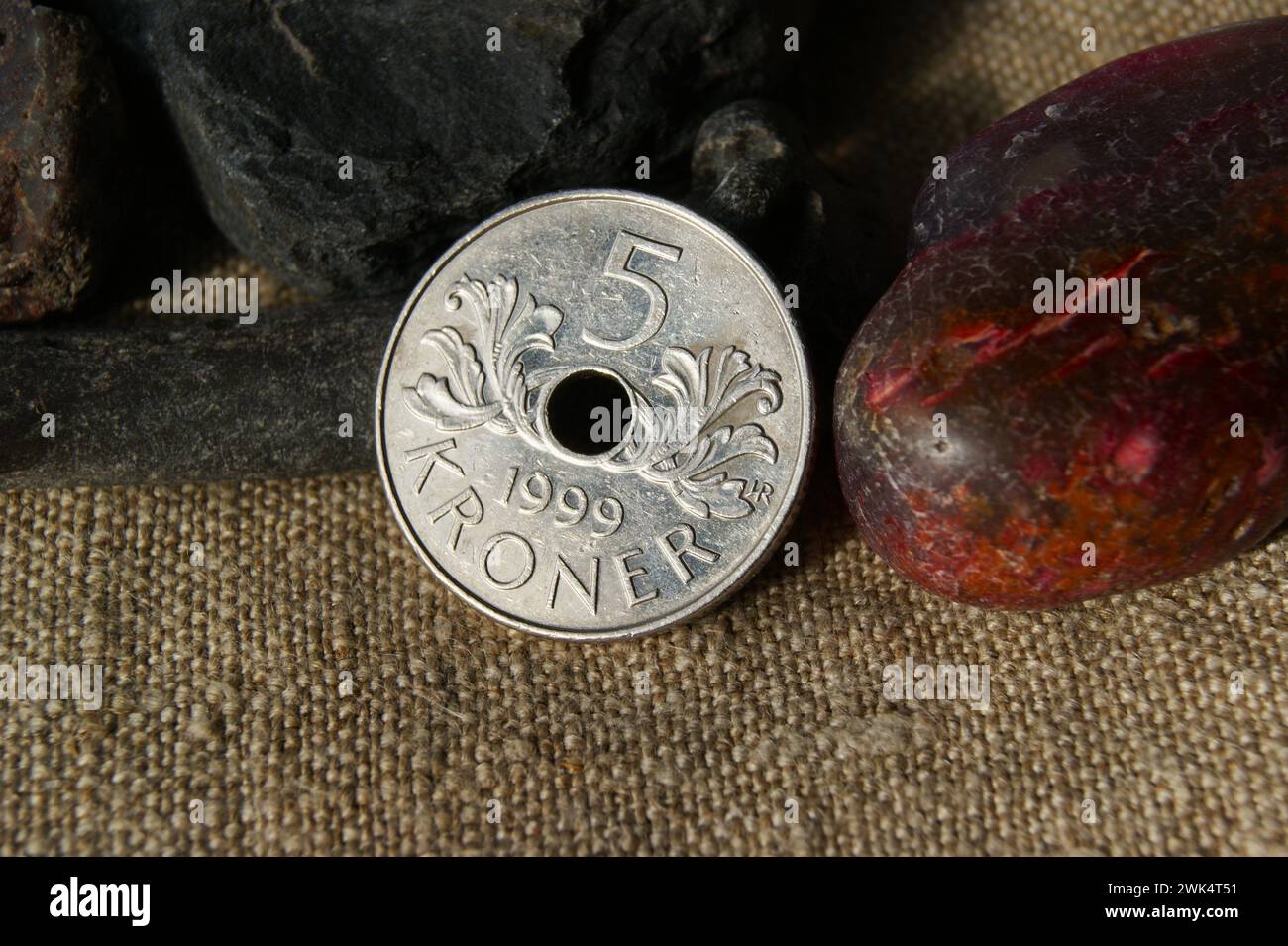 A coin with a hole 5 Kroner Harald V 1999 Stock Photo - Alamy