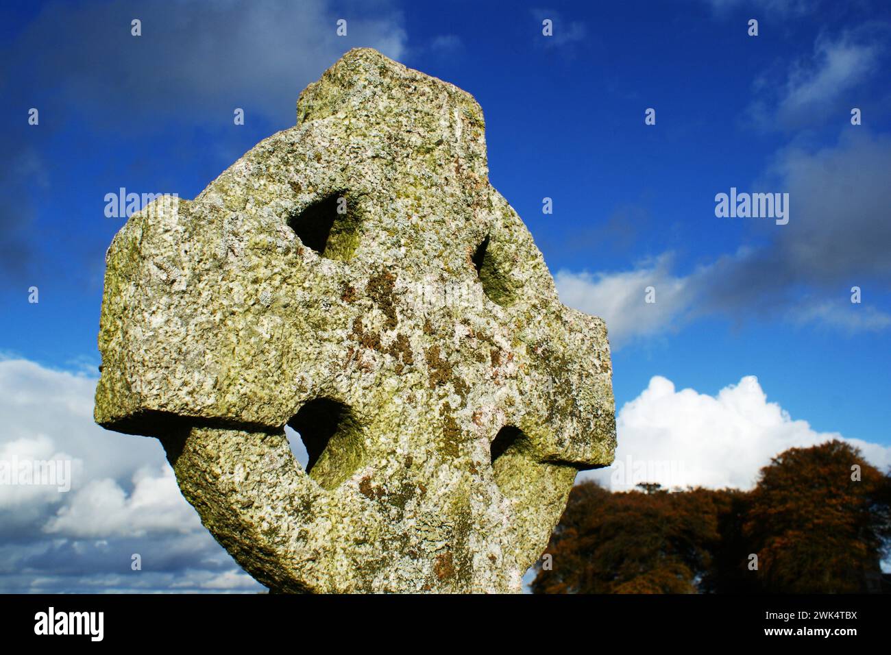 Stone cross. Old Celtic cross on sky background Stock Photo - Alamy