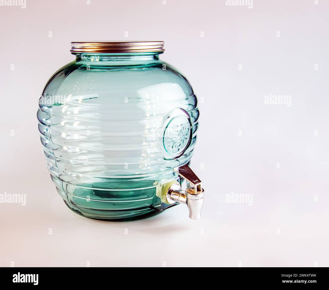 Large glass container for wine with a tap on a white background Stock ...