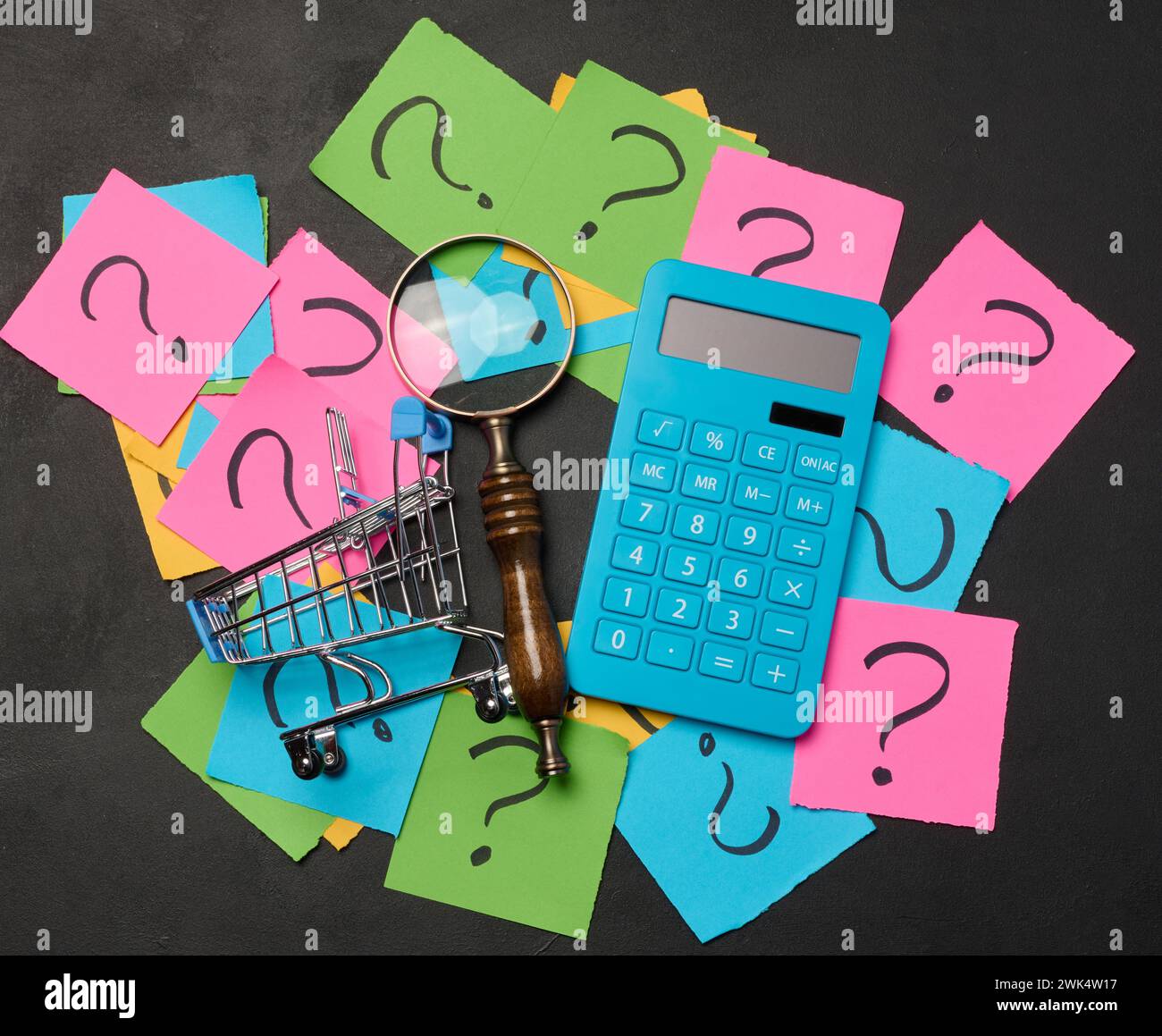 Drawn question marks on stickers and a magnifying glass, yellow ...