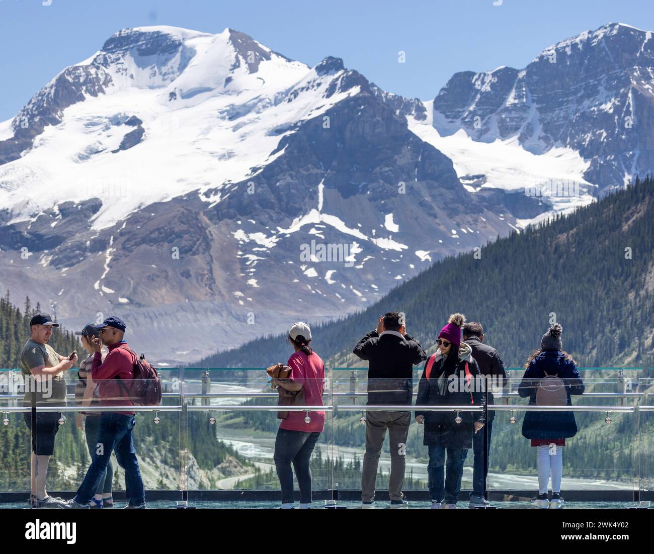 Tourists admiring view from the glass floored observation deck of the ...
