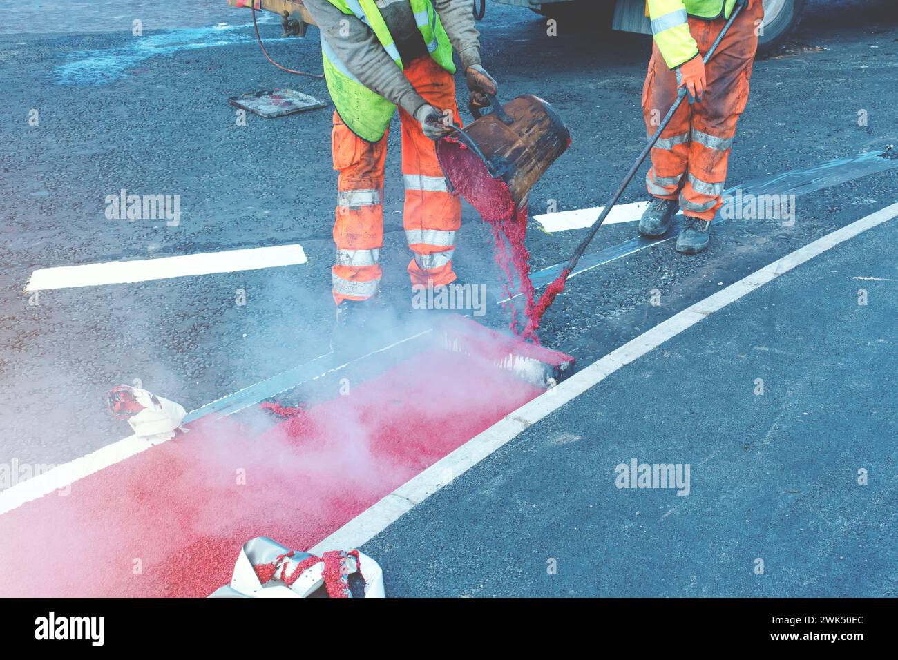 Thermoplastic road marking paint hi-res stock photography and images ...