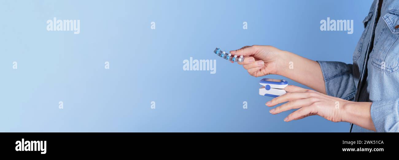 Woman self testing for blood oxygen levels from pulse oximeter Stock ...