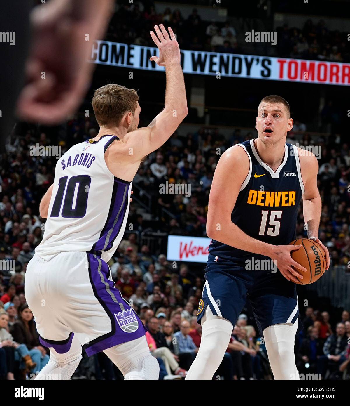 Denver Nuggets center Nikola Jokic (15) and Sacramento Kings forward Domantas Sabonis (10) in ...