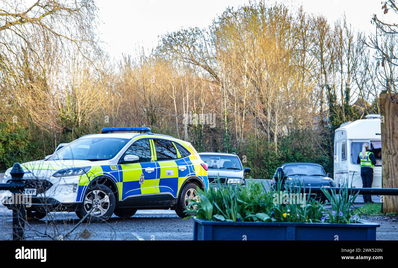 Wiltshire police car parked with a police woman in the background ...