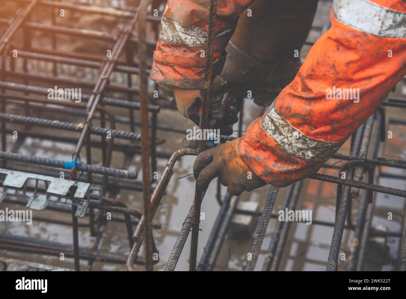 Construction worker steel fixer working at the building site close-up ...