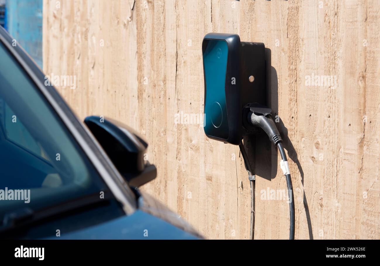 Electric vehicle domestic charging point installed outside of the house ...