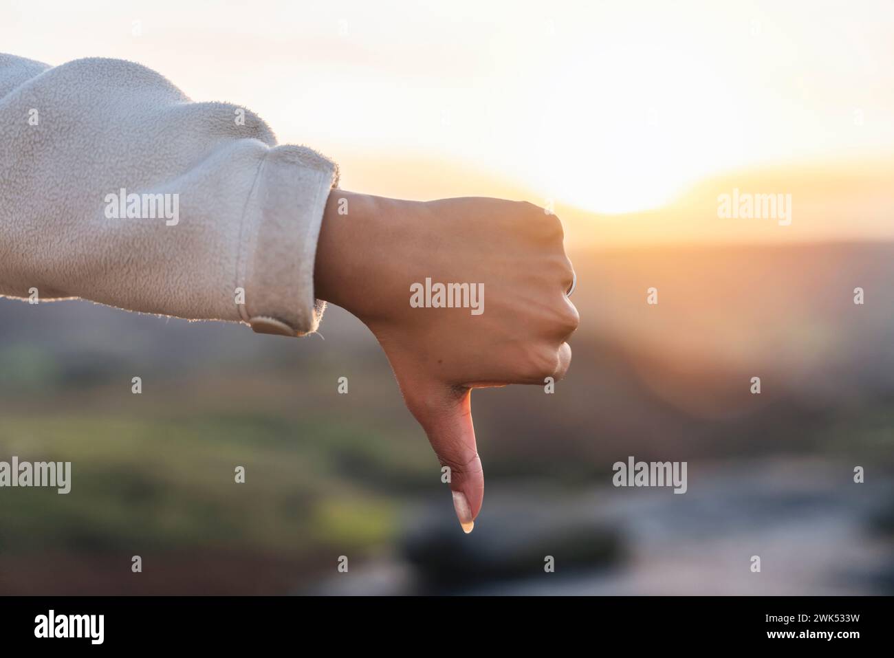 woman giving thumb down gesture, dislikes something, having disgusting ...