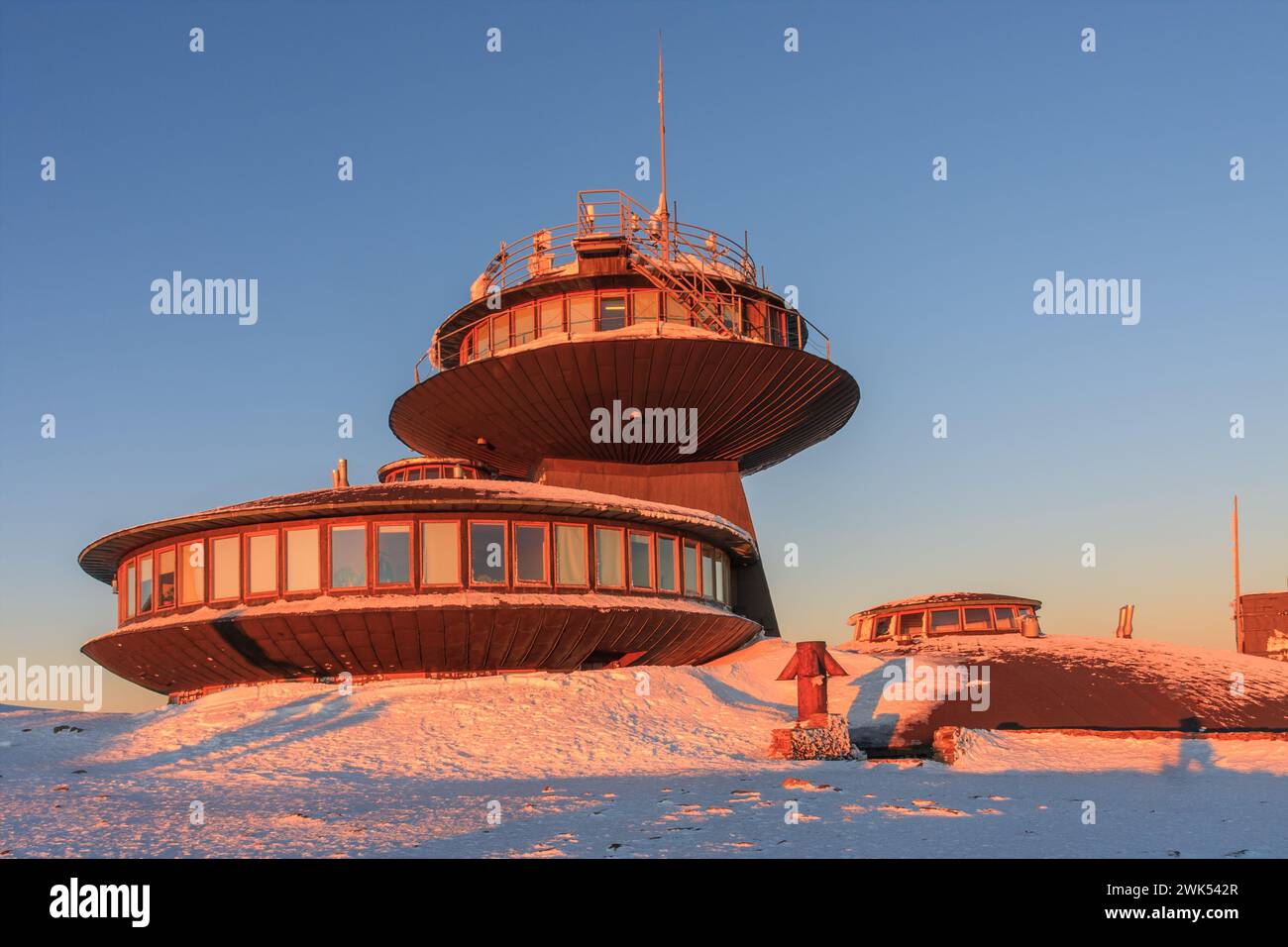 Winter, sunrise time, disc shaped meteorological observatory in snezka ...