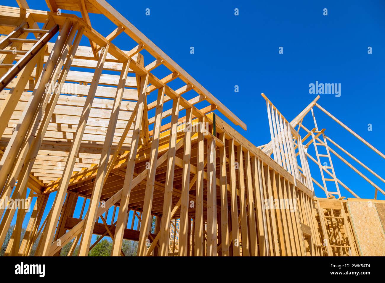 Timber wood stick frames framing beams during construction of new home ...