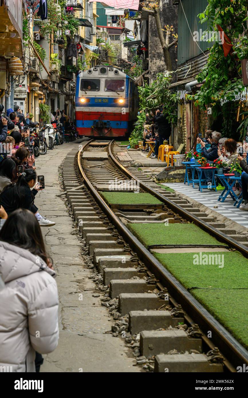 An approaching Vietnamese railway train on Train Street, Hanoi, Vietnam ...