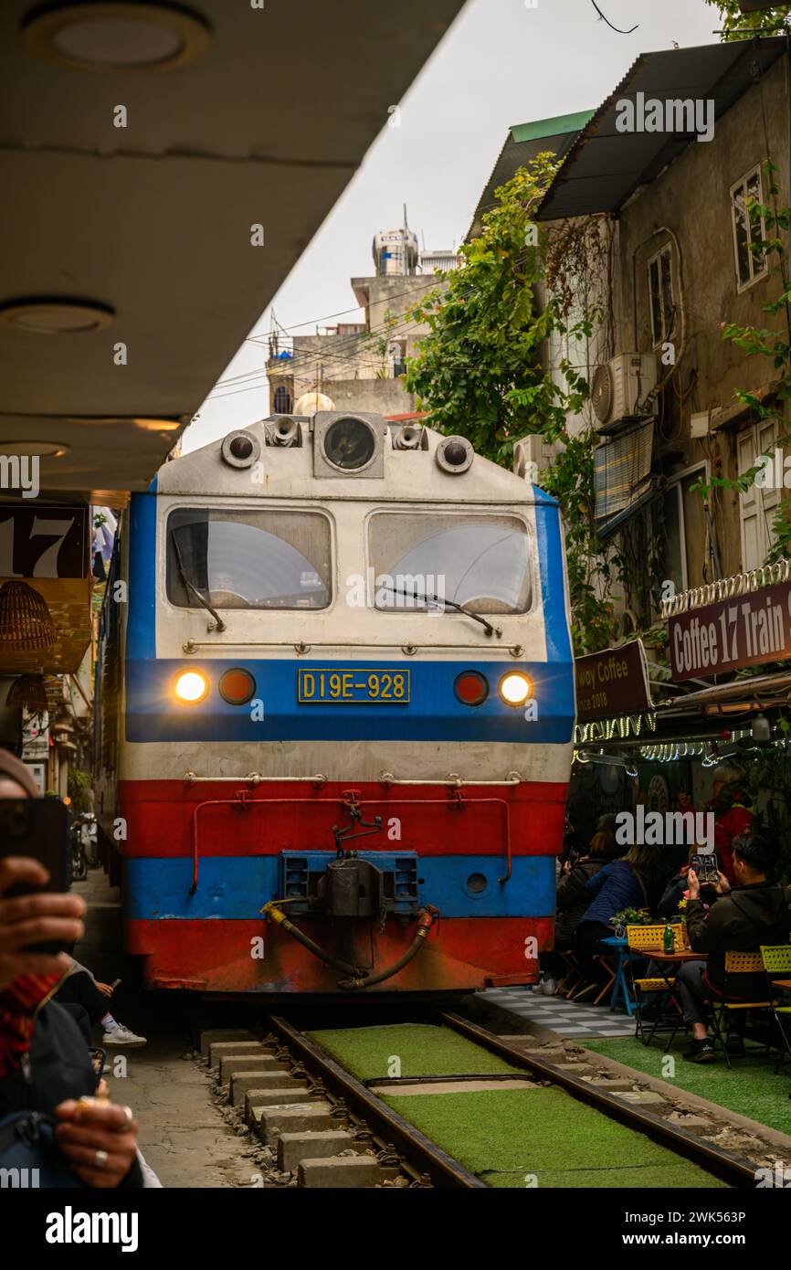 An approaching Vietnamese railway train on Train Street, Hanoi, Vietnam ...